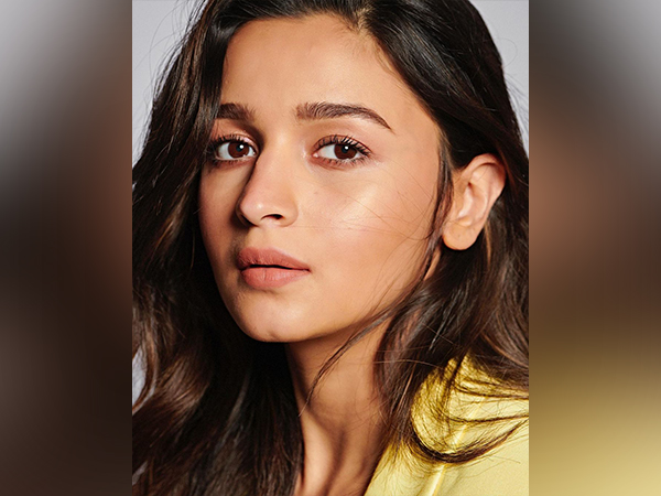 Alia oozes charm in yellow pantsuit; see photos