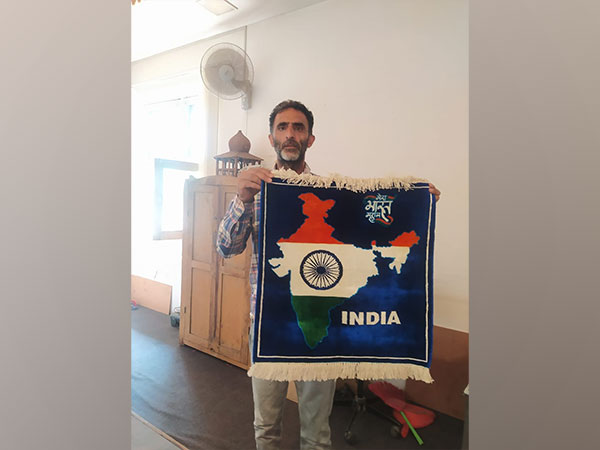 Kashmiri craftsman's silk carpet honors India's map