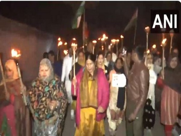 Congress workers take out torch rally in Uttar Pradesh's Lucknow in ...