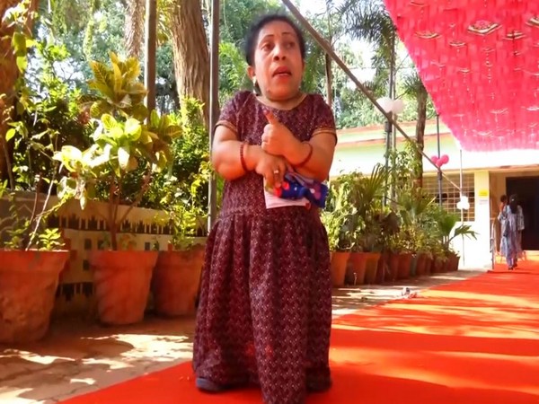 Dwarf woman climbs chair to cast her vote in Odisha
