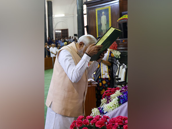 PM Modi touches Constitution book to forehead upon his arrival at ...
