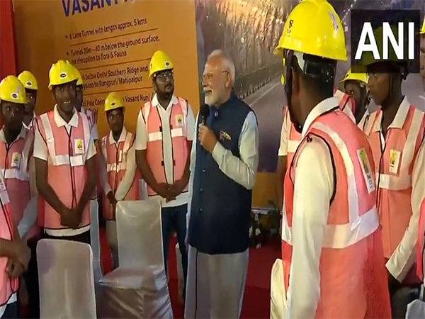 PM Modi interacts with construction workers before inauguration of two ...