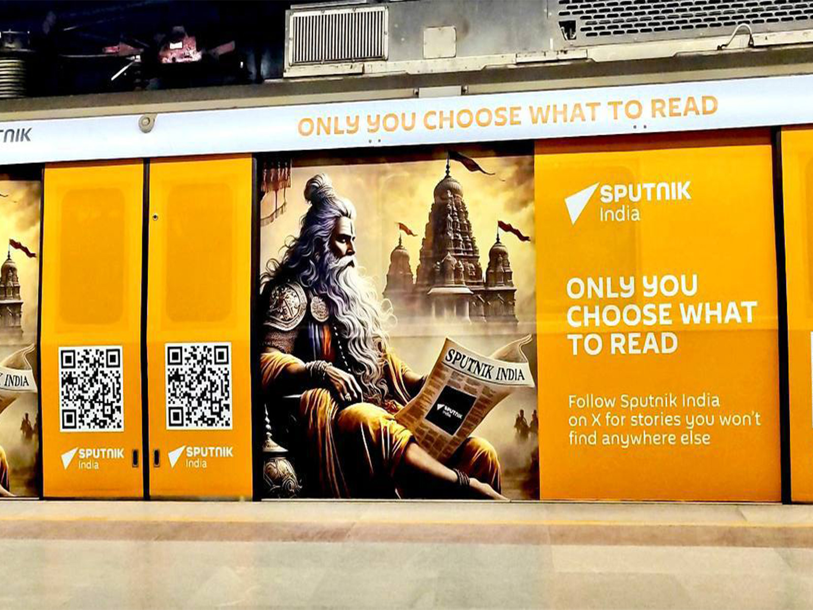 Sputnik India coils Delhi Metro's Yellow Line with their logos, slogans, and QR codes