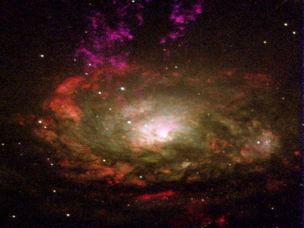 Luminous galaxy reionizing surroundings 13 billion years ago