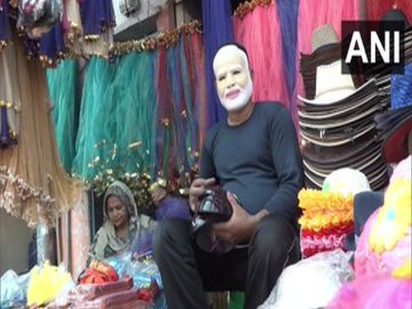 Uttar Pradesh: Holi fever grips Prayagraj, Modi masks in demand