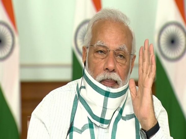 PM Modi sticks to trusted 'gamcha' mask