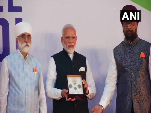 PM Modi releases commemorative coin marking 550th birth anniversary of ...