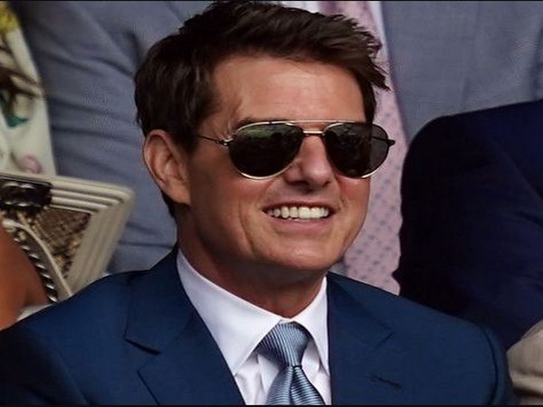 Tom Cruise takes 'socially-distanced' photos with fans at Euro 2020 Final