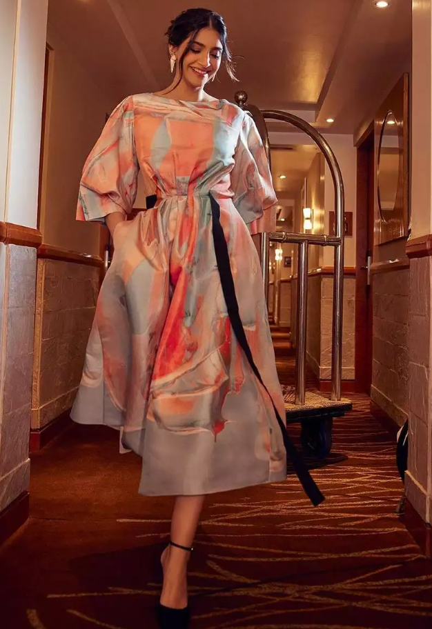 Take inspiration from Bollywood divas to master the satin dress trend